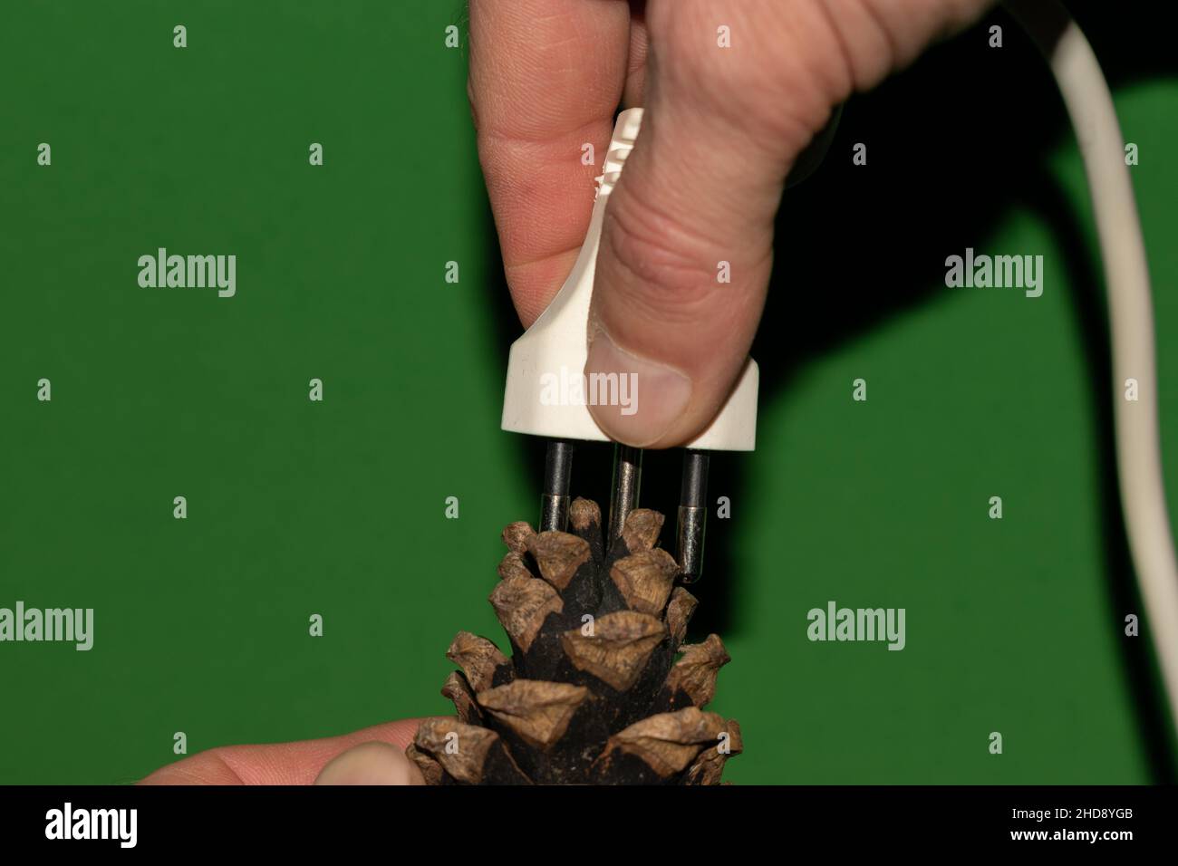 Vaduz, Liechtenstein, December 23, 2021 Trying to put a plug into a ...