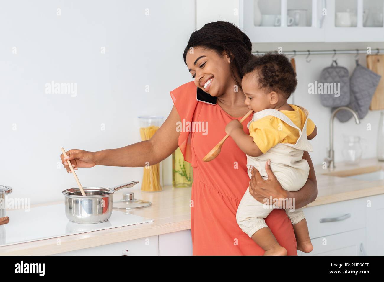 Multitasking Woman Cooking High Resolution Stock Photography and Images ...