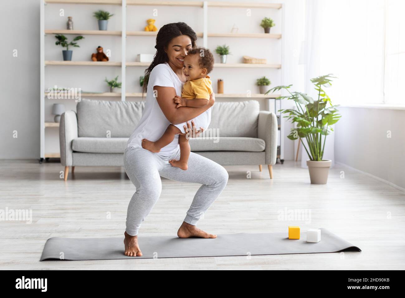 Postpartum Weight Loss. Happy Black Lady Making Squats With Baby On ...