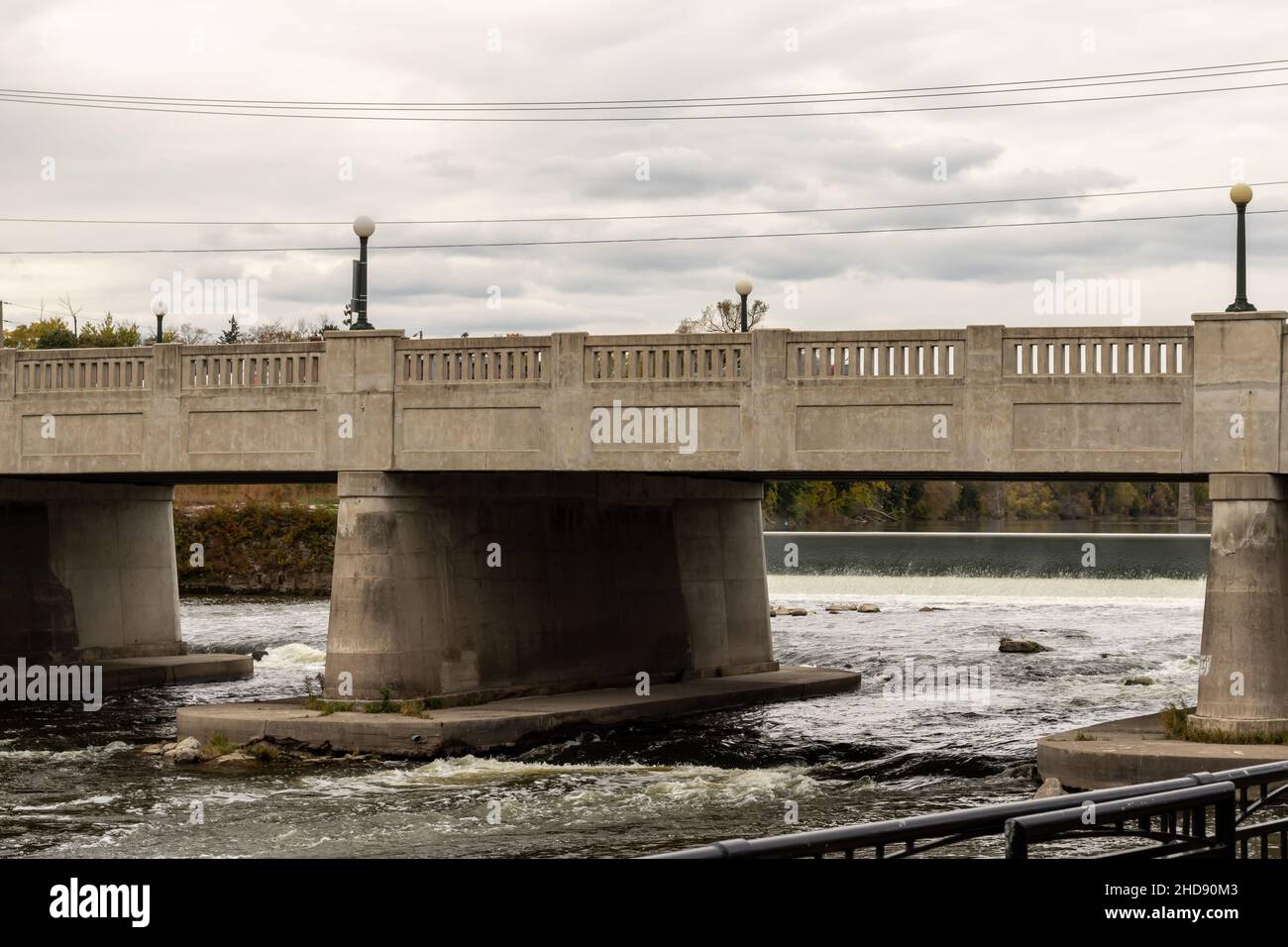 Concrete bridge with lampposts over the Grand River in Cambridge ...
