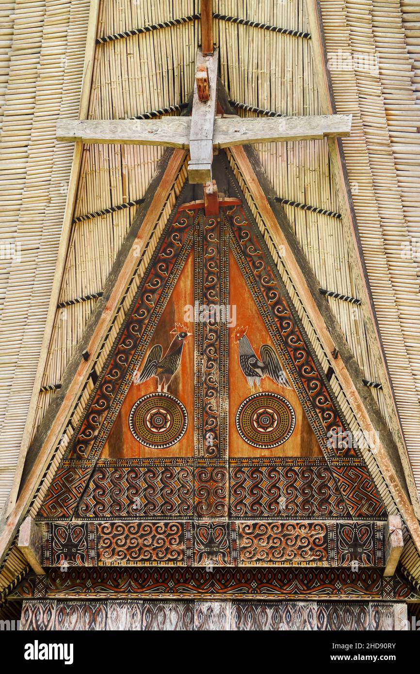 Detail of gable on a tongkonan (rice barn/house) with cockerel & sun ...