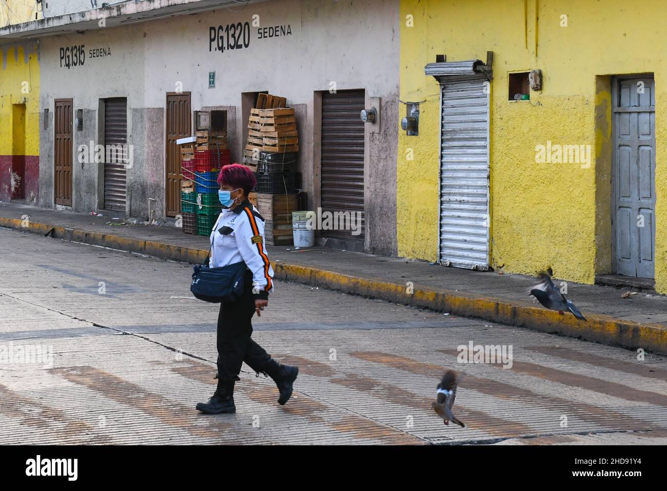 Woman wearing a face mask walking in Centro Merida, Mexico during the ...
