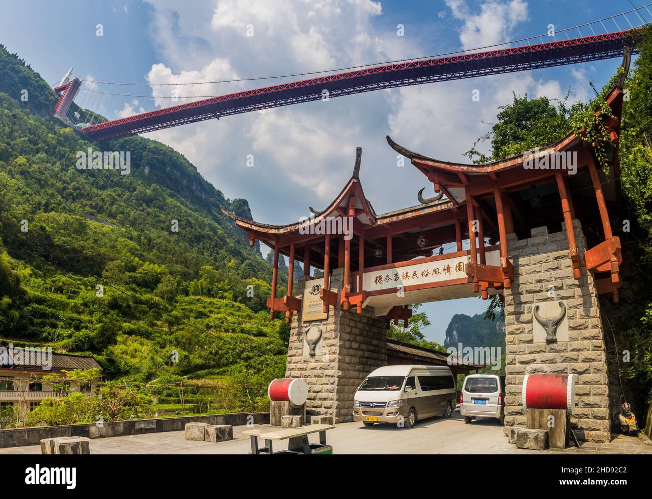 AIZHAI, CHINA - AUGUST 12, 2018: Arch at a road under Aizhai suspension ...