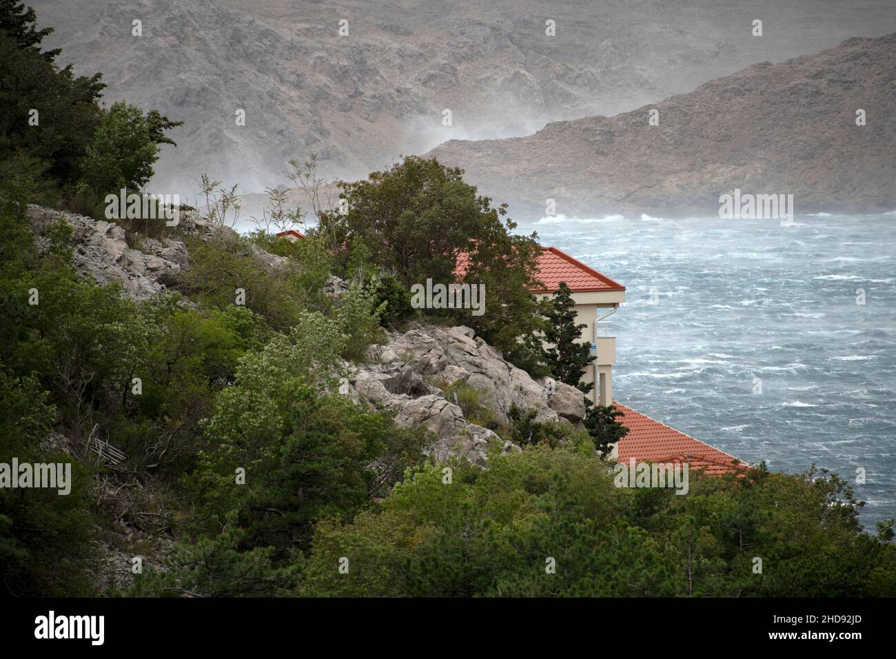 windy sea island with a house stormy waters Stock Photo - Alamy