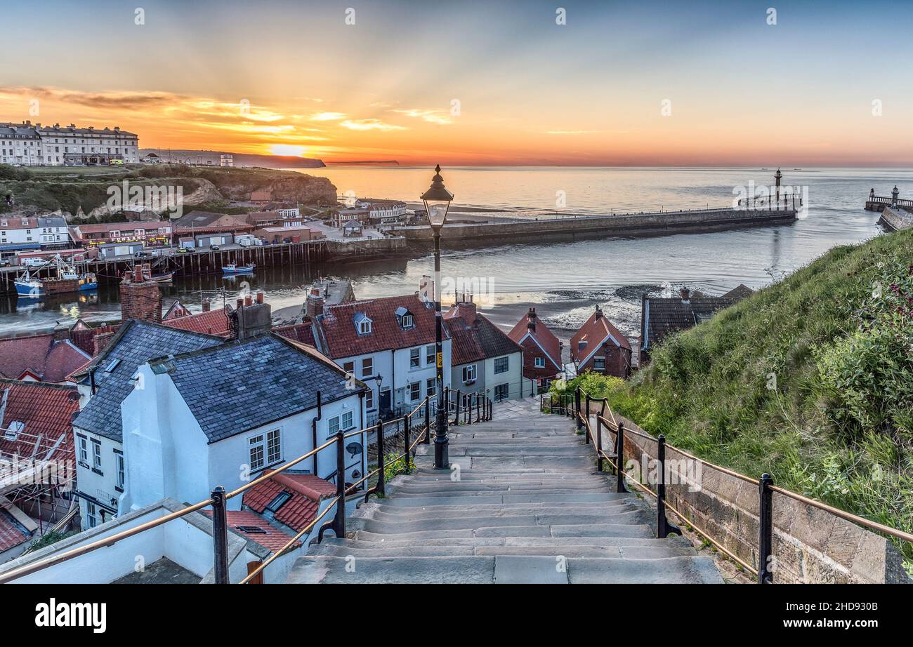 Scenic view of the 199 Steps spot in Whitby, England on a sunset sky ...