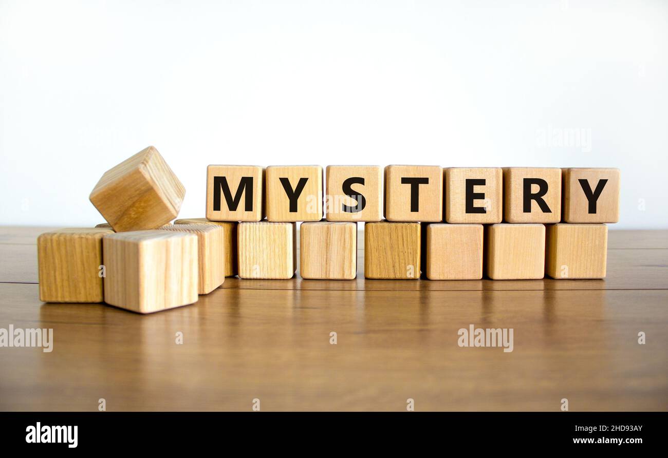 Mystery symbol. The concept word Mystery on wooden cubes. Beautiful ...