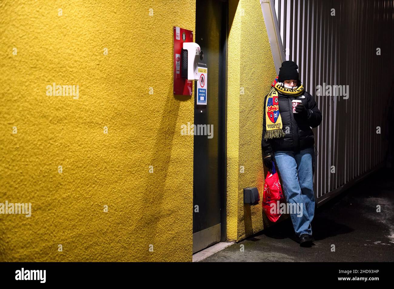 A Harrogate Town fan outside the ground ahead of the Papa John's Trophy ...