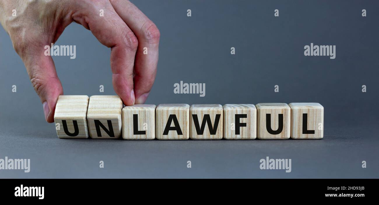 Lawful or unlawful symbol. Businessman turns wooden cubes and changes ...
