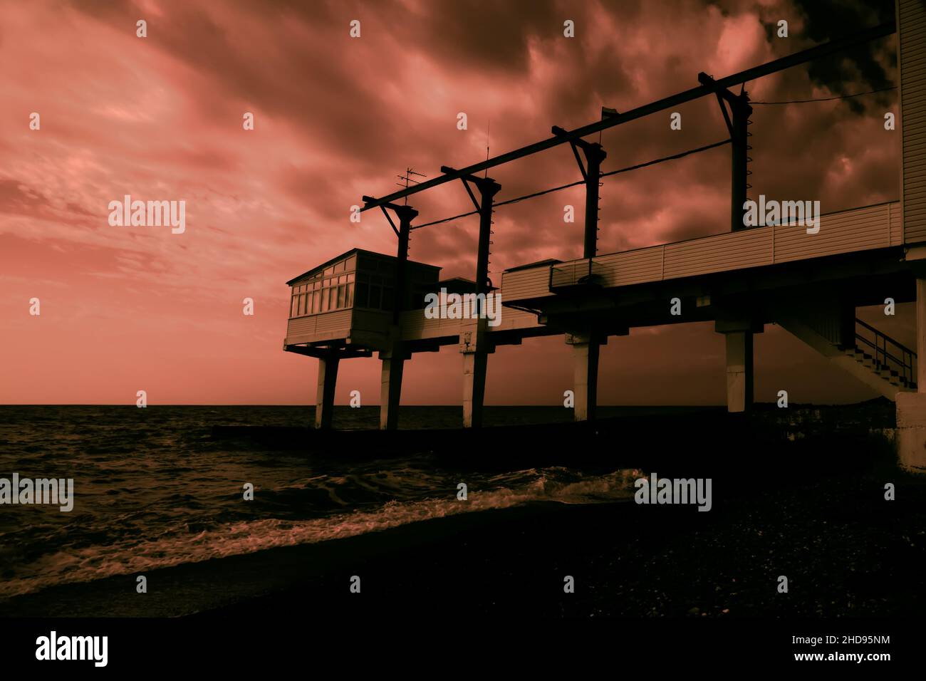 glazed pavilion on the edge of the pier going into the sea, observation ...