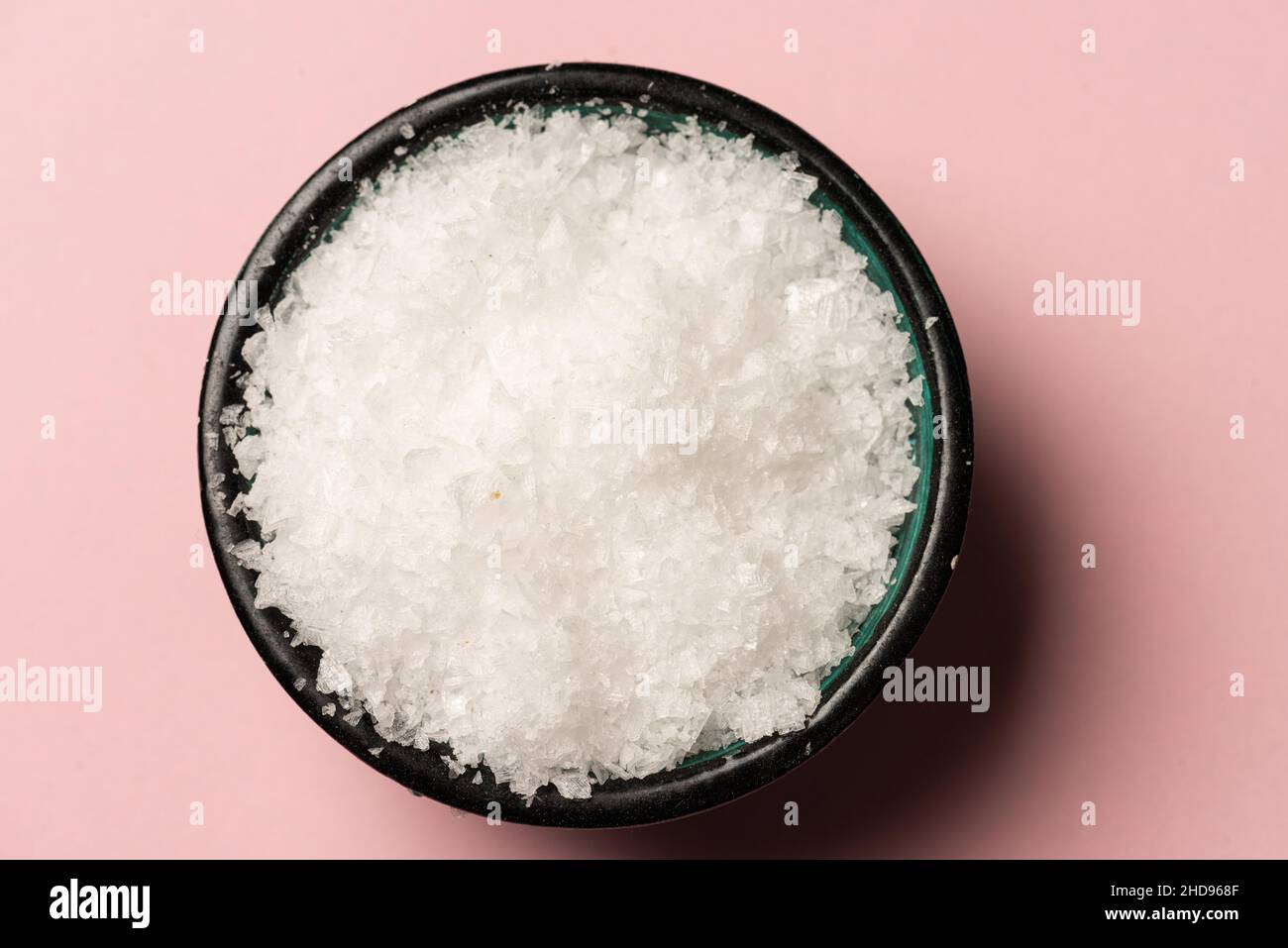 Sea salt in a small cup Stock Photo - Alamy