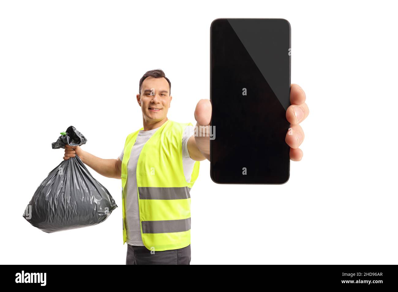Waste collector holding a bin bag and a smartphone isolated on white ...