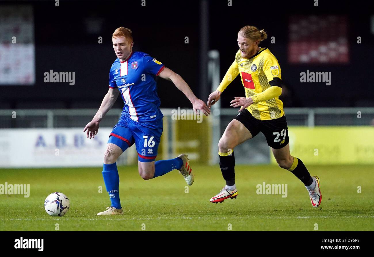 Harrogate Town's Luke Armstrong (right) and Carlisle United's Morgan ...