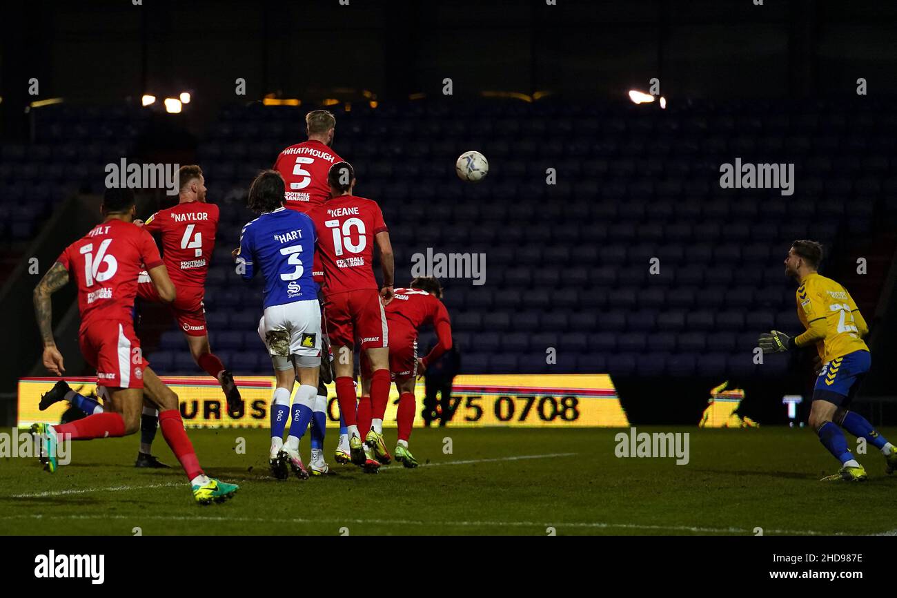 Wigan Athletic's Tom Naylor scores their side's first goal of the game ...