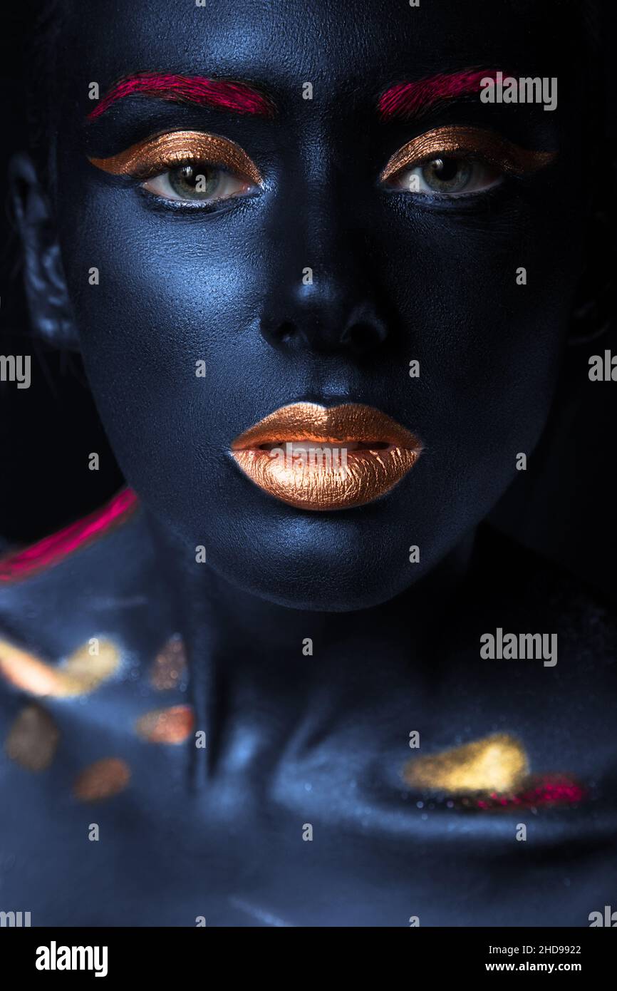 fashion portrait of a blue-skinned girl with color make-up. Beauty face ...