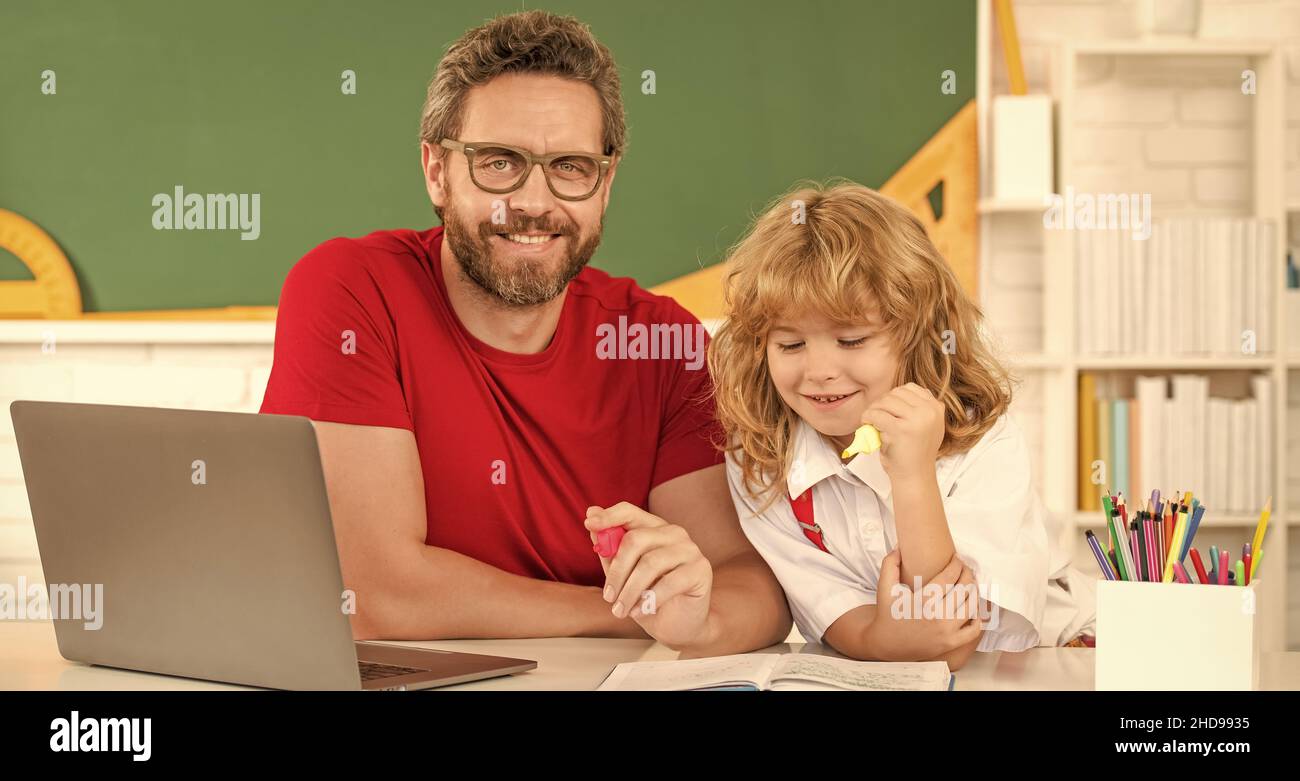 daddy and son study in classroom with laptop, online education Stock Photo - Alamy