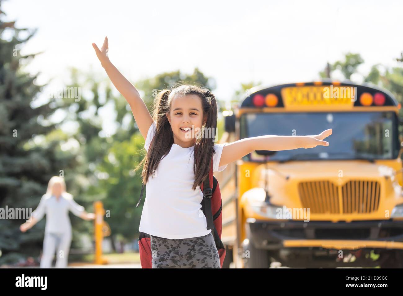 Kids student running into mother's hands to hug her after back to ...