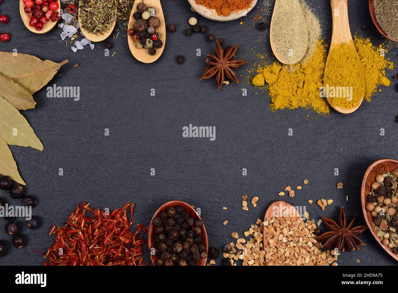 Background and frame made of various spices, some of which are on ...