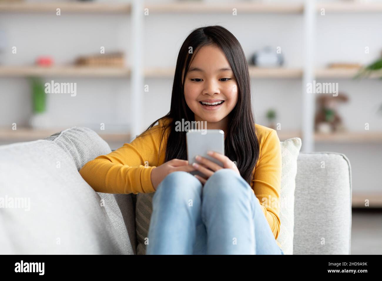 Asian kids playing video game hi-res stock photography and images - Alamy