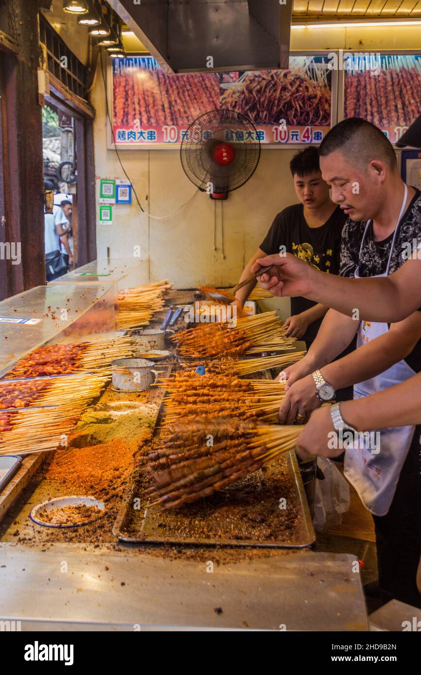 CHONGQING, CHINA - AUGUST 17, 2018: Meat skewer stall in Ciqikou ...