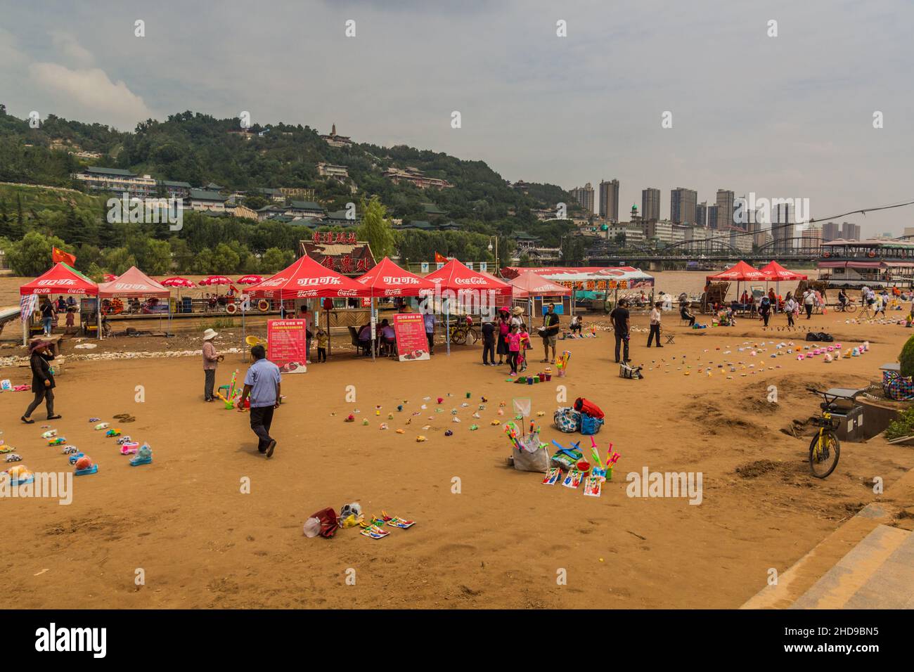 LANZHOU, CHINA - AUGUST 18, 2018: Market at the coast of Yellow river ...