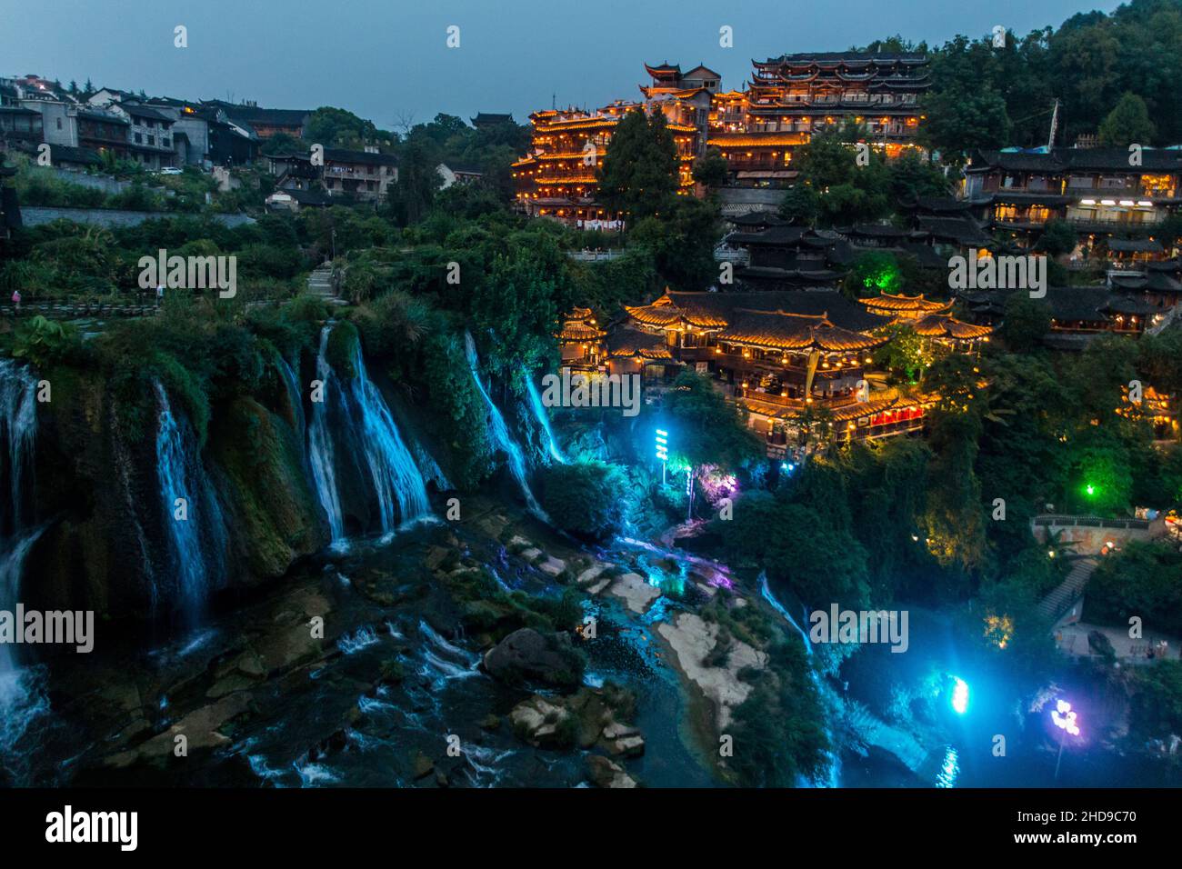 Evening view of Furong Zhen town and waterfall, Hunan province, China ...