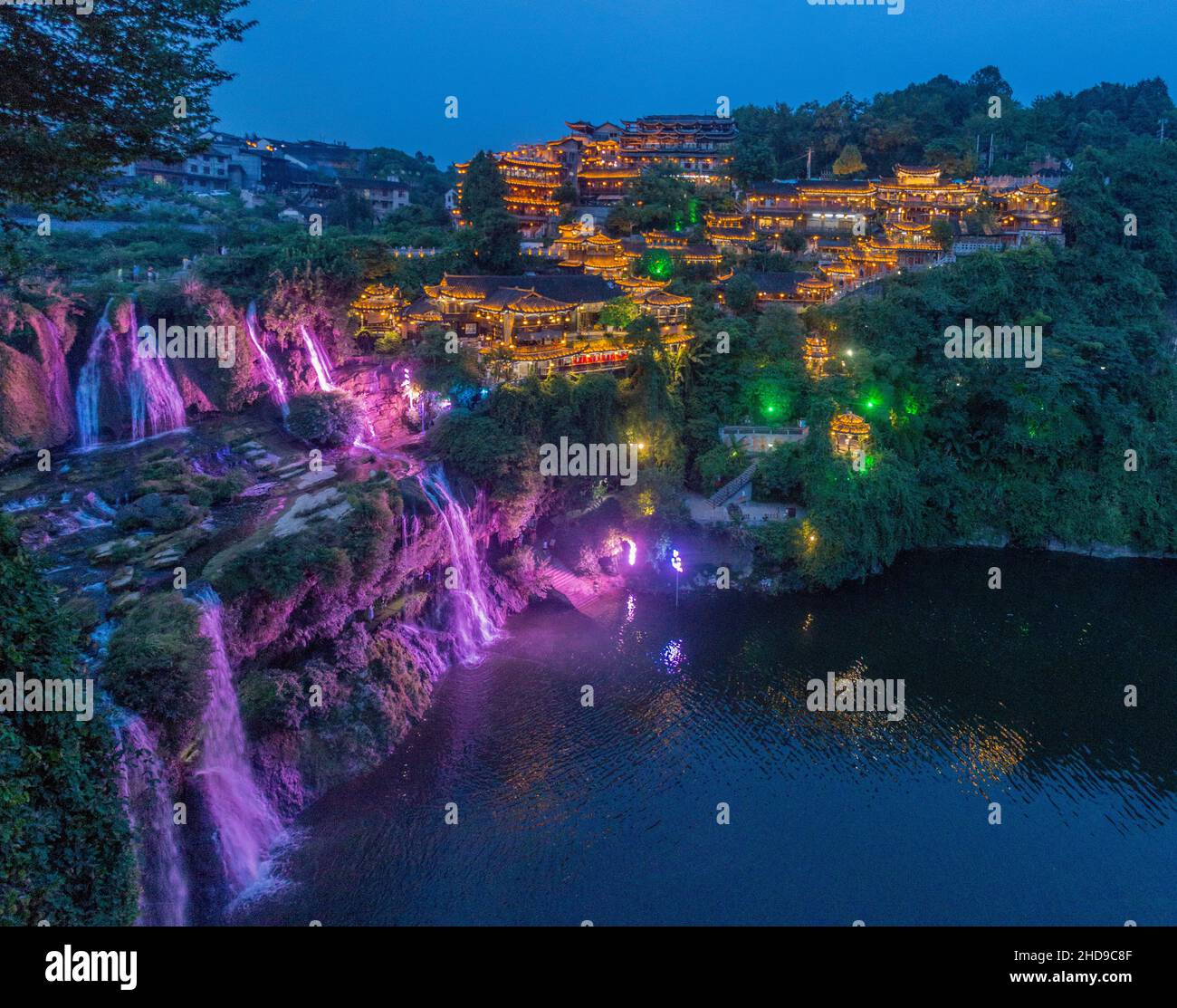 Evening view of Furong Zhen town and waterfall, Hunan province, China ...