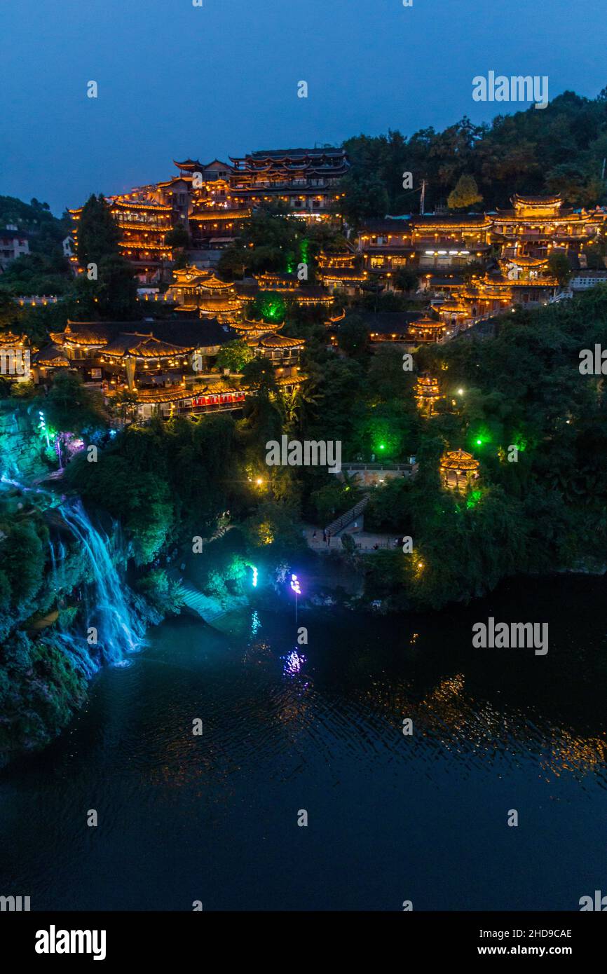 Evening view of Furong Zhen town and waterfall, Hunan province, China ...
