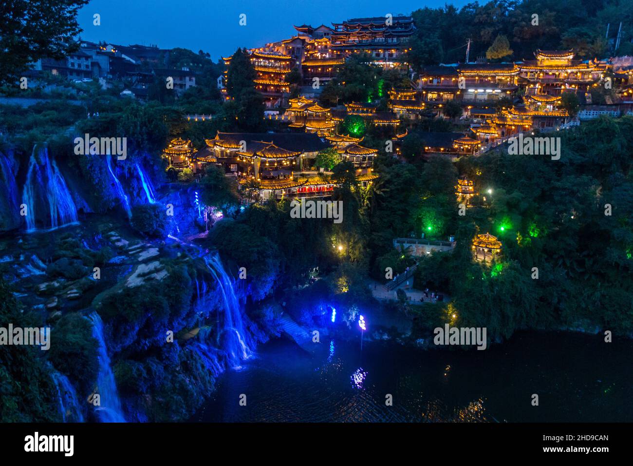 Evening view of Furong Zhen town and waterfall, Hunan province, China ...