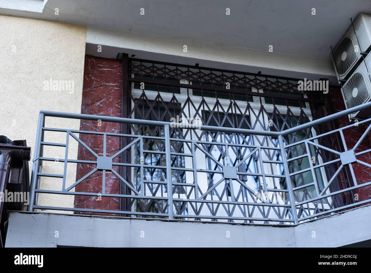 Glass doors with grating on it. grate Stock Photo - Alamy