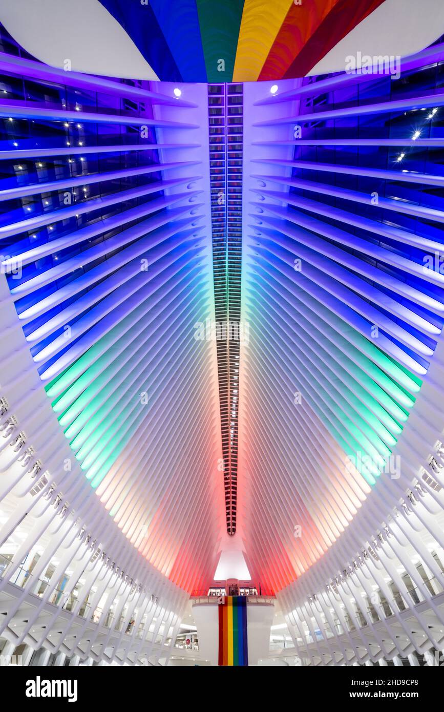 Reflection of the Pride flag colors on the inside walls of a bridge ...
