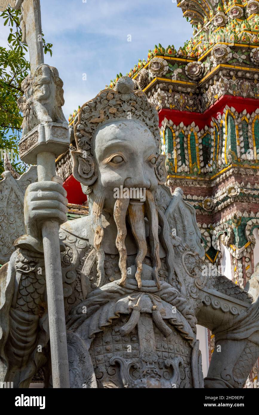 statue of mythical thai warrior standing guard at a large buddhist ...
