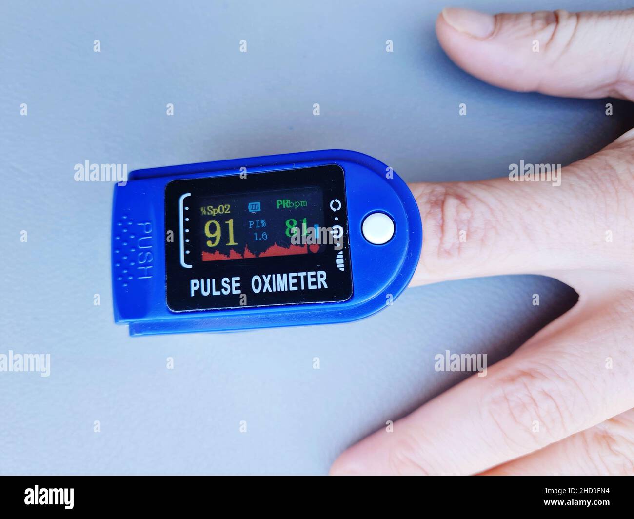 Woman measuring blood oxygen hi-res stock photography and images - Alamy