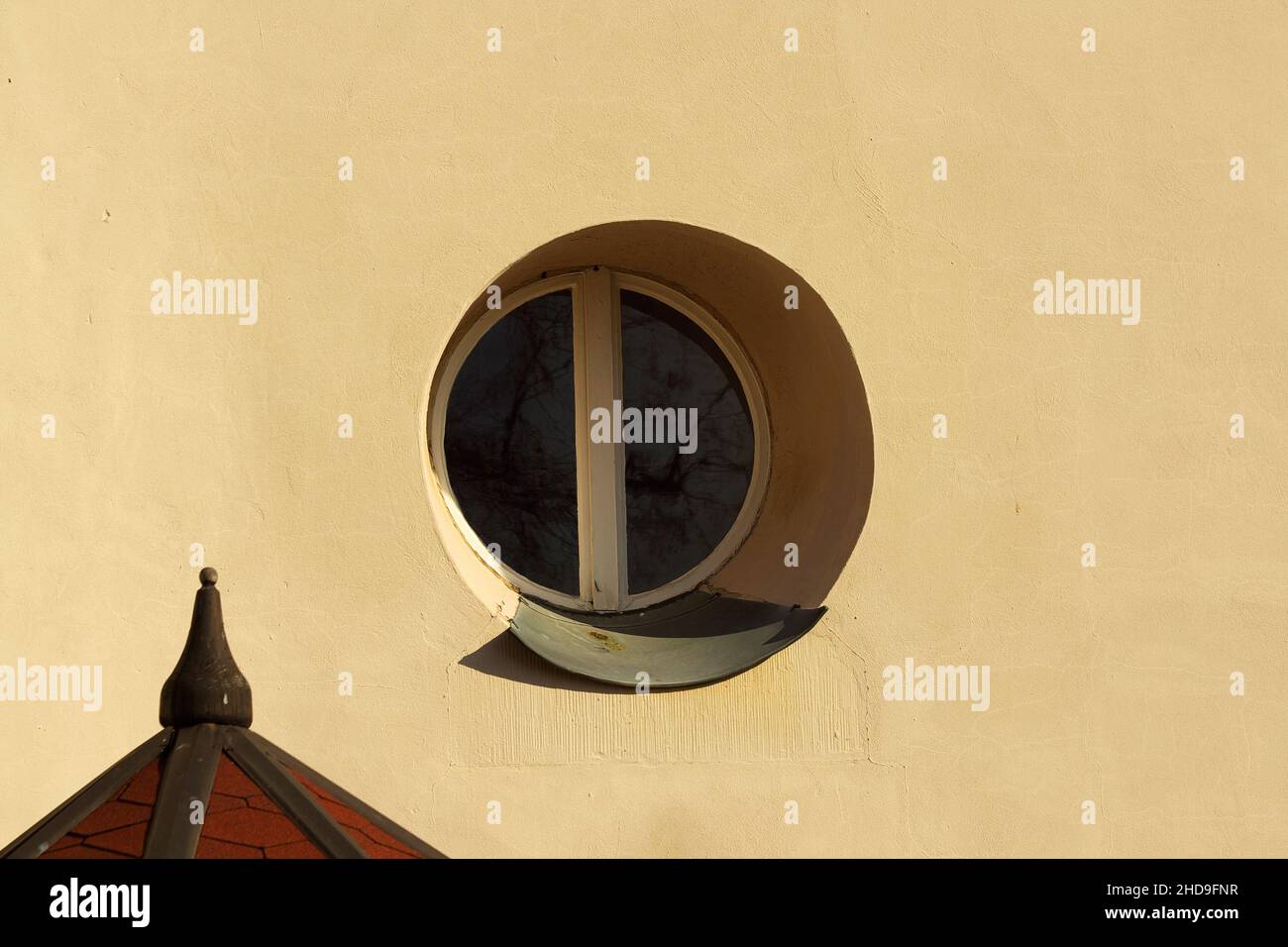 Tranquil scenery of a round window of a building in sunlight Stock ...