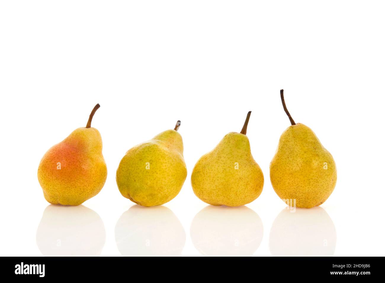 Four fresh pears in a row isolated over white background Stock Photo ...