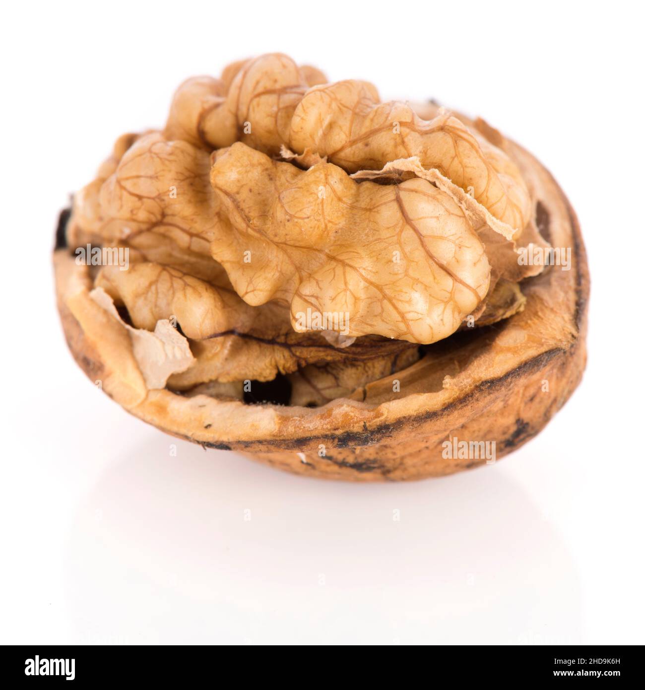 Cracked walnut isolated over white background Stock Photo - Alamy