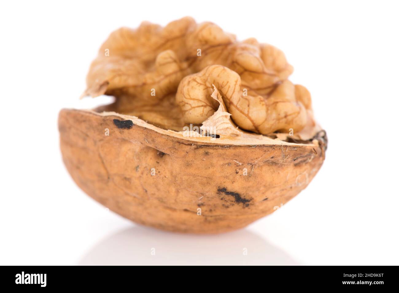 Cracked walnut isolated over white background Stock Photo - Alamy