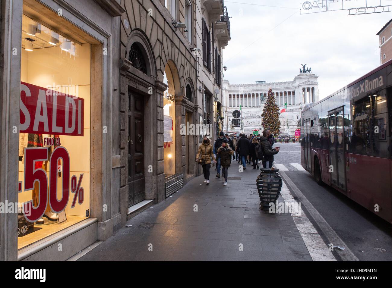 Rome, Italy. 4th Jan, 2022. People walk in front of the window of a ...