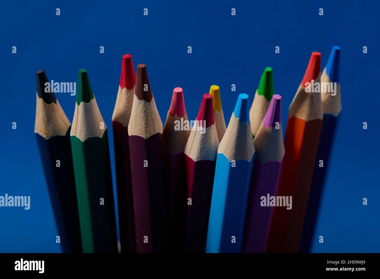 Closeup of colored pencils put vertically next to each other with a ...