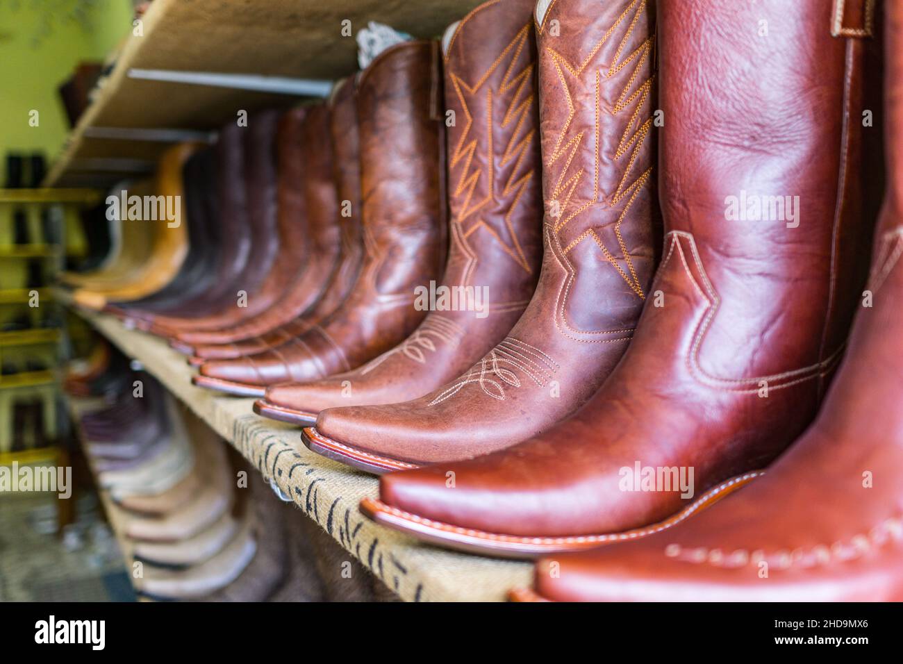 A row of boots in a boot maker's shop in Jinotega, Nicaragua. Typical ...