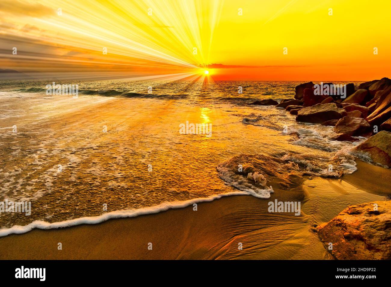 A Colorful Ocean Sunset With Sun Rays Emanating Over the Ocean Horizon ...