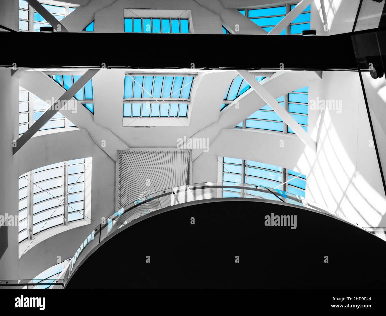 Geometric staircase and glass roof in a modern building. Look up ...