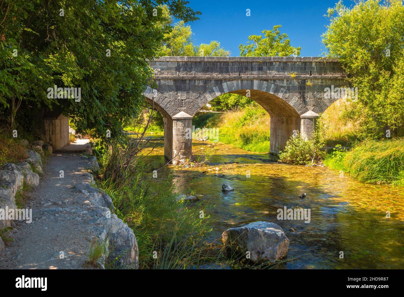 Stone bridge on the lower reaches of the river Zrnovnica, near Split ...