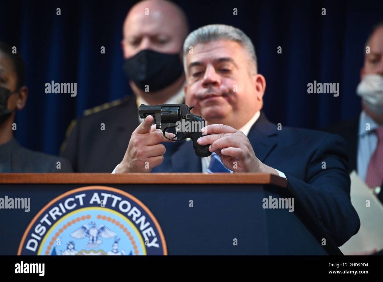 Brooklyn District Attorney Eric Gonzalez holds a seized .38 revolver ...