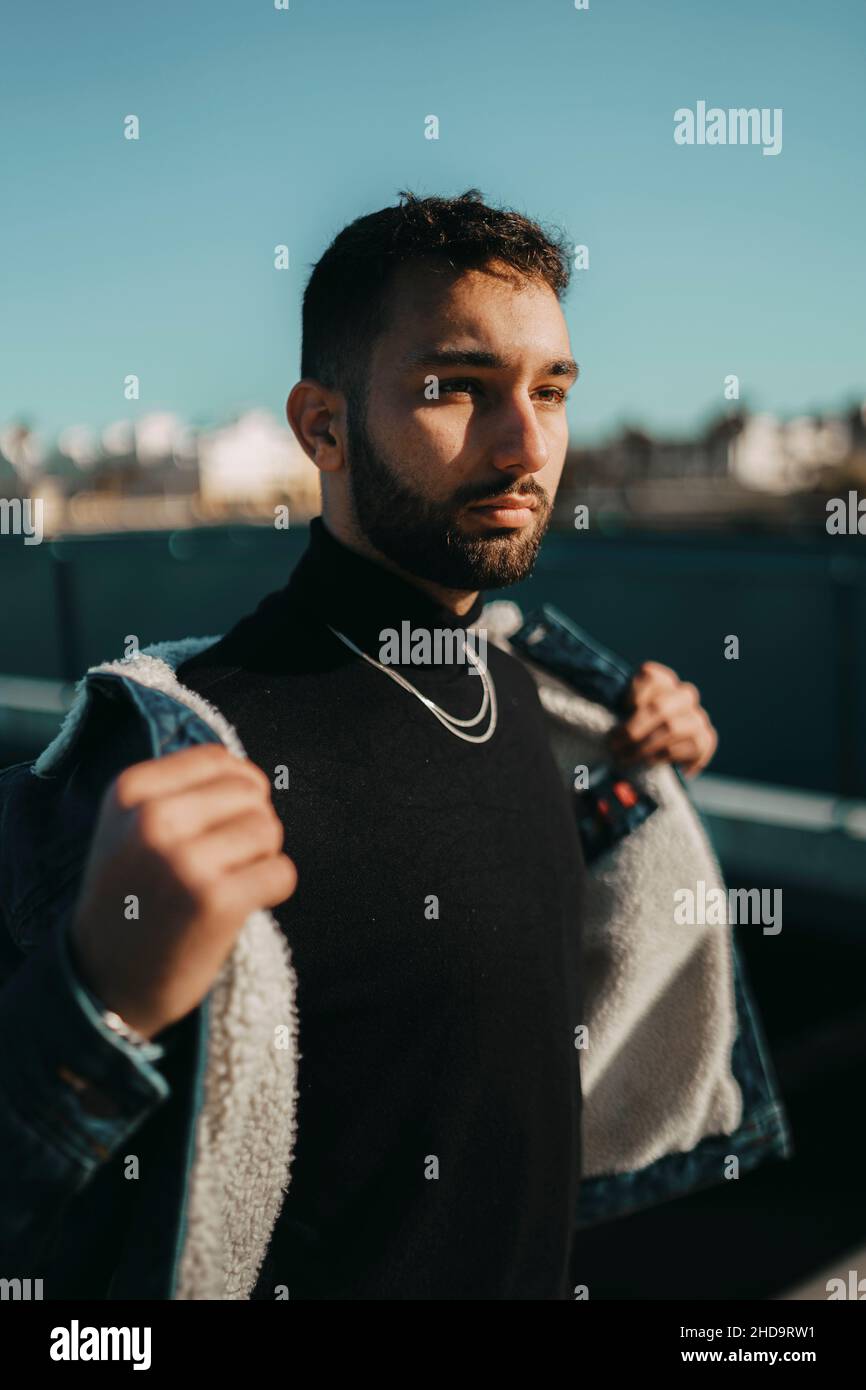 Young handsome Caucasian male posing at a beach resort Stock Photo - Alamy