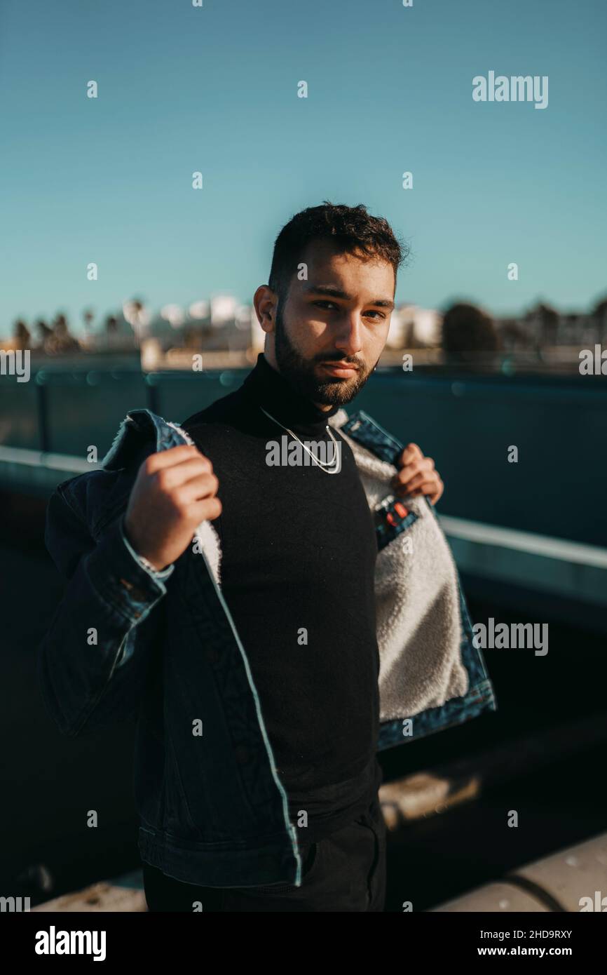 Young handsome Caucasian male posing at a beach resort Stock Photo - Alamy