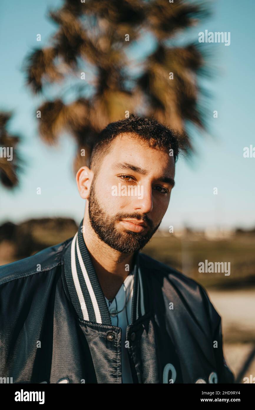 Young handsome Caucasian male posing at a beach resort Stock Photo - Alamy