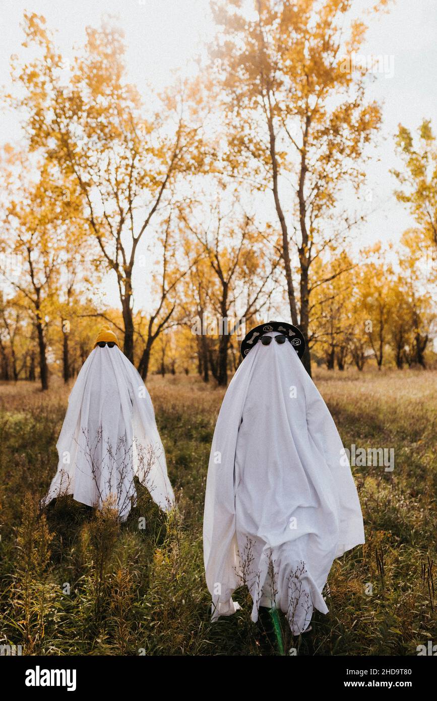 Two people dressed as ghosts looking directly into camera Stock Photo ...