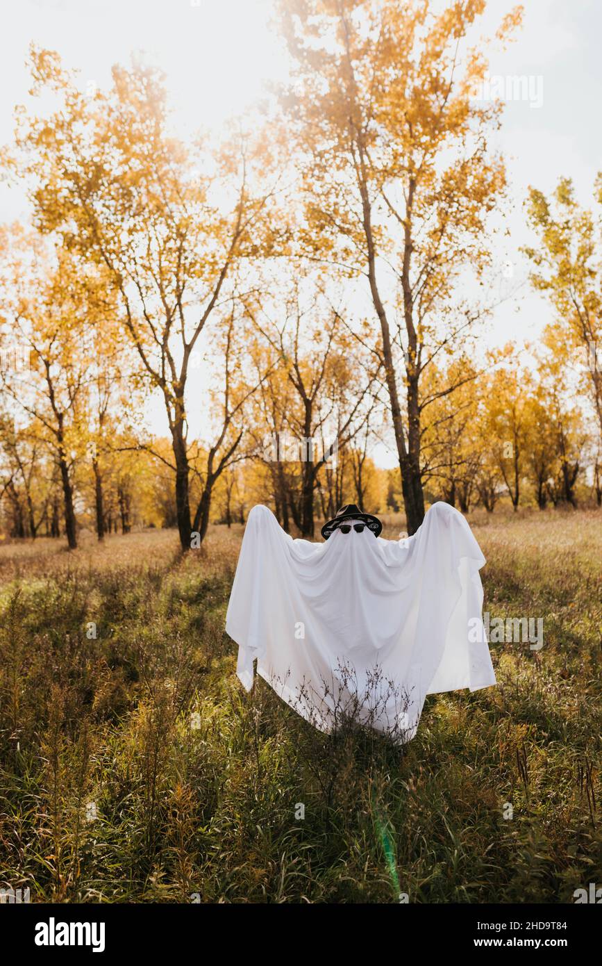 Full body image of person dressed as ghost looking at camera Stock ...