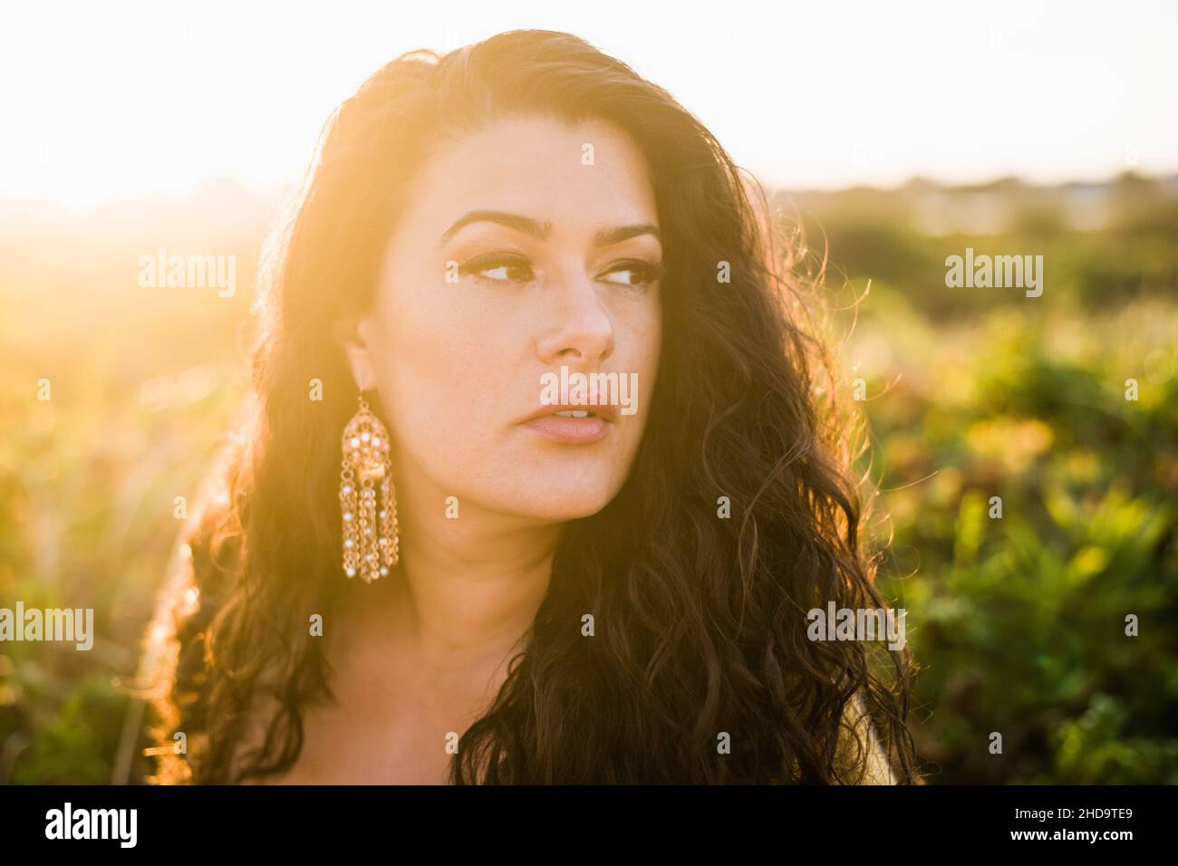 Glam Golden Hour Portrait of Brunette Woman at beach Stock Photo - Alamy