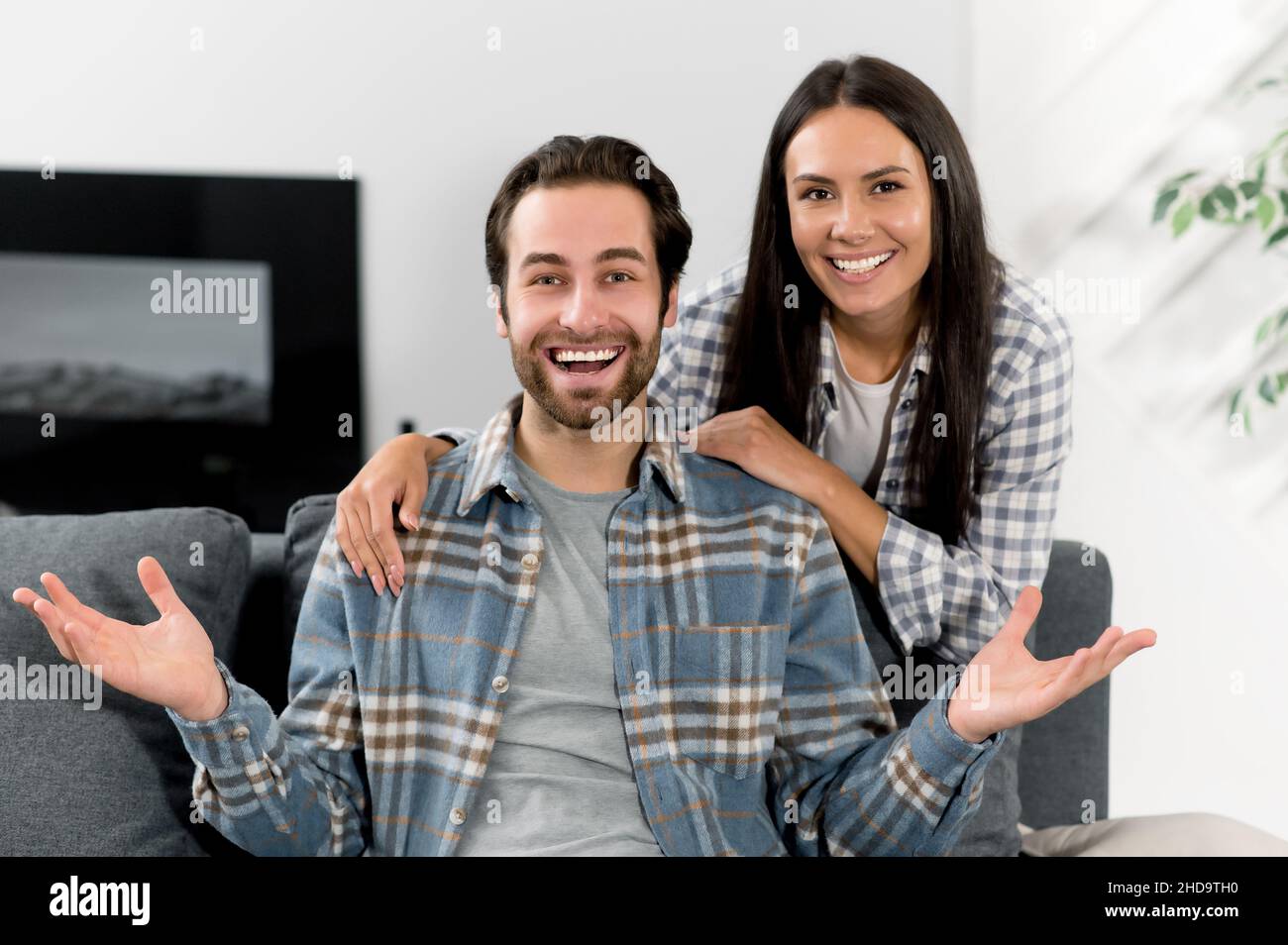 Couple flirting on sofa hi-res stock photography and images - Alamy